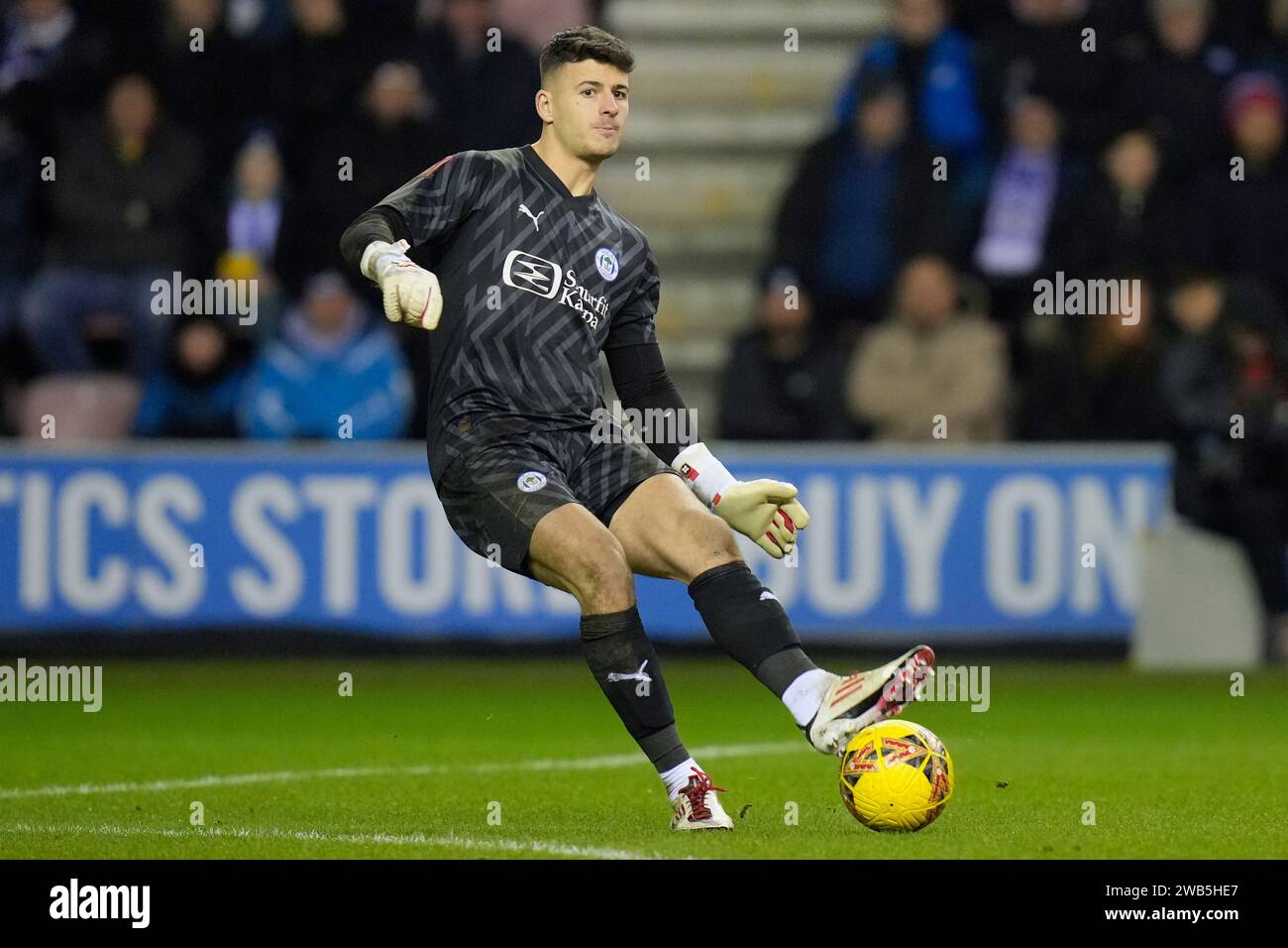 Wigan, UK. 08th Jan, 2024. Sam Tickle of Wigan Athletic clears the ball ...