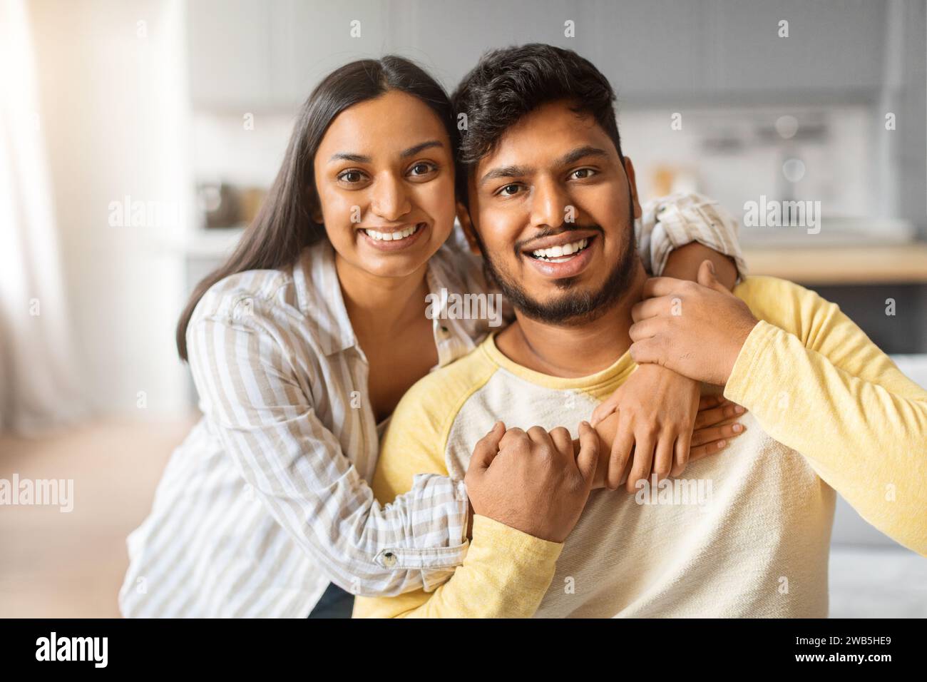 Indian couple hug smile cuddle hi-res stock photography and images - Alamy