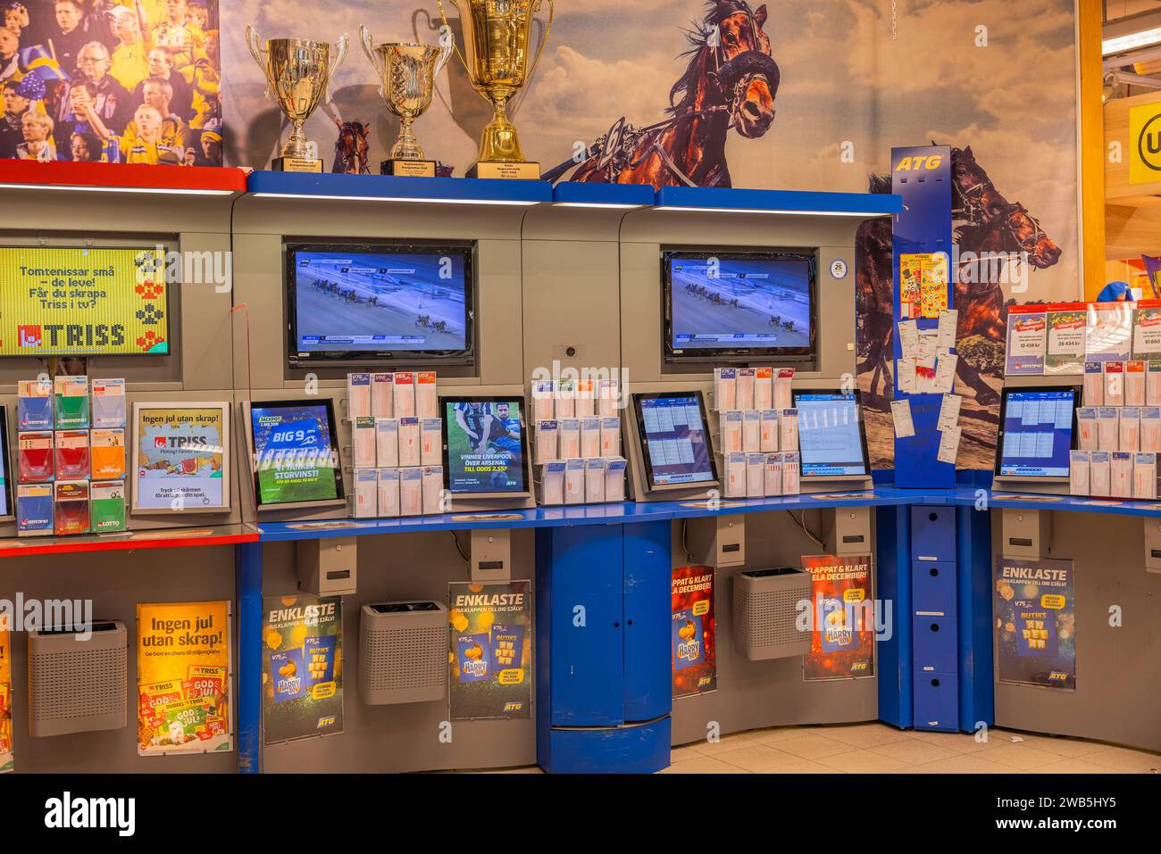 Corner with counters for filling out tickets and placing bets on horse ...