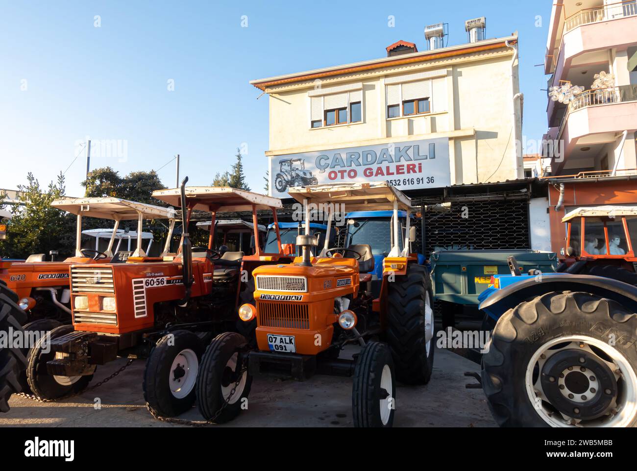 Tractors outdoor store display, Car dealer in Serik, Türkiye Stock ...
