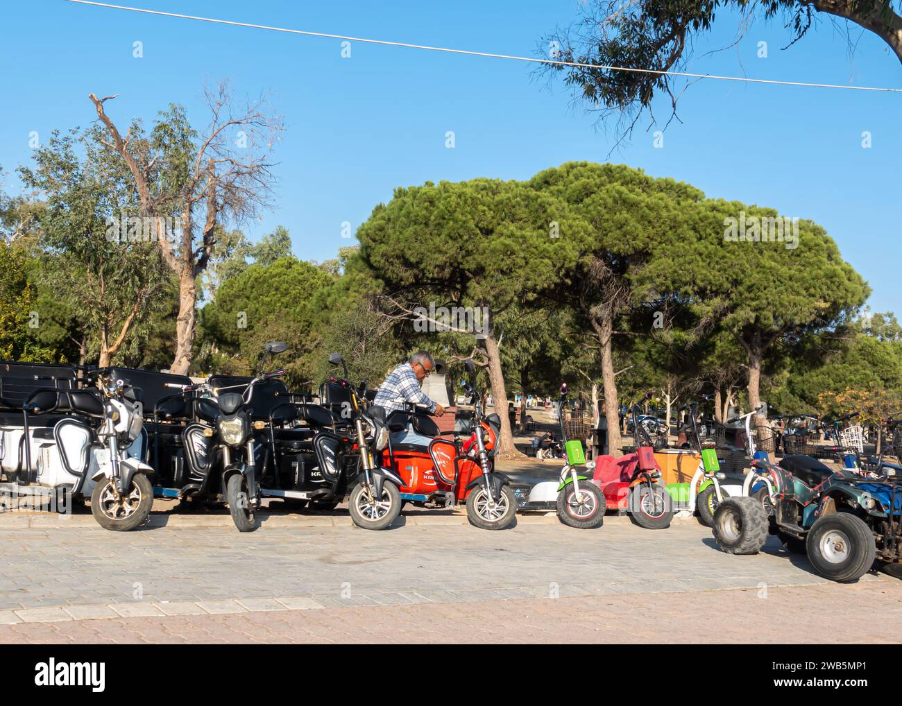 Man using motor bikes cart vehicles Lora beach Antalya Turkey Stock ...
