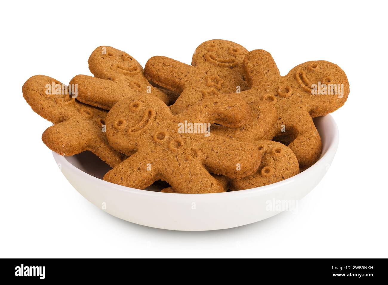 Gingerbread man in ceramic bowl isolated on white background Stock ...