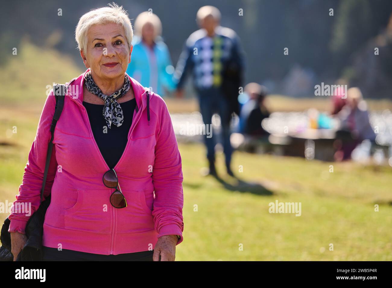 A senior woman finds serenity and wellness as she strolls through ...