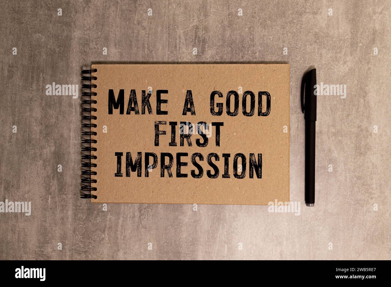 Businessman hold white card with text Make a good first impression ...