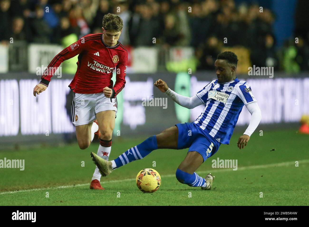 Wigan, UK. 08th Jan, 2024. Steven Sessegnon of Wigan Athletic looks to ...