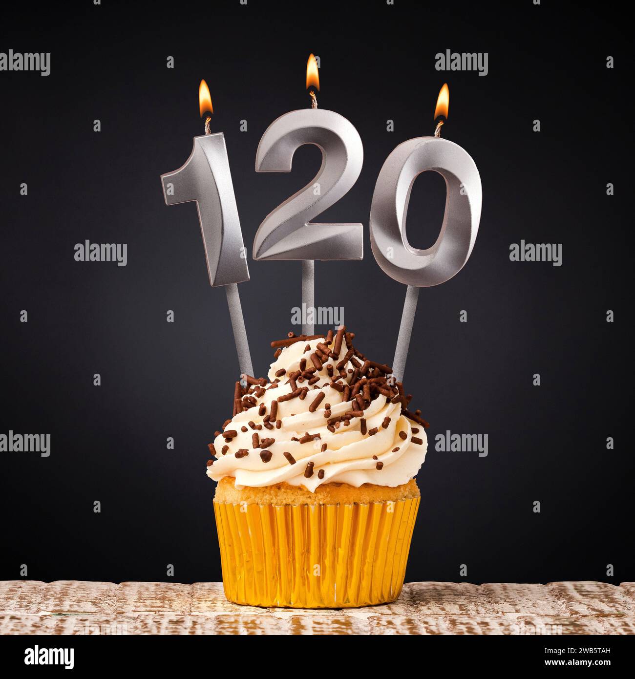 birthday cupcake with number 120 candle - Celebration on dark ...
