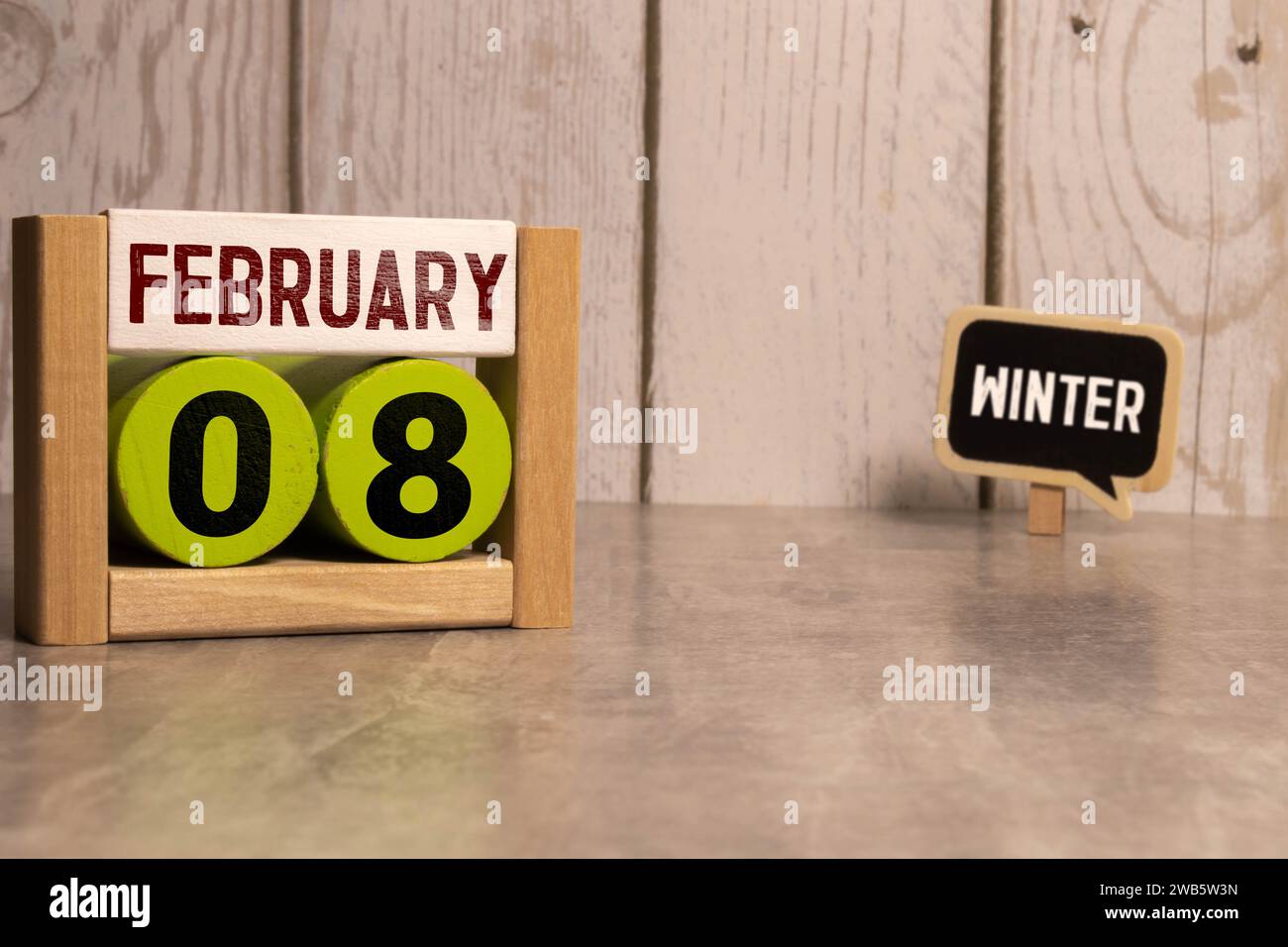 February 08. 8th day of the month, wooden calendar isolated on a white ...