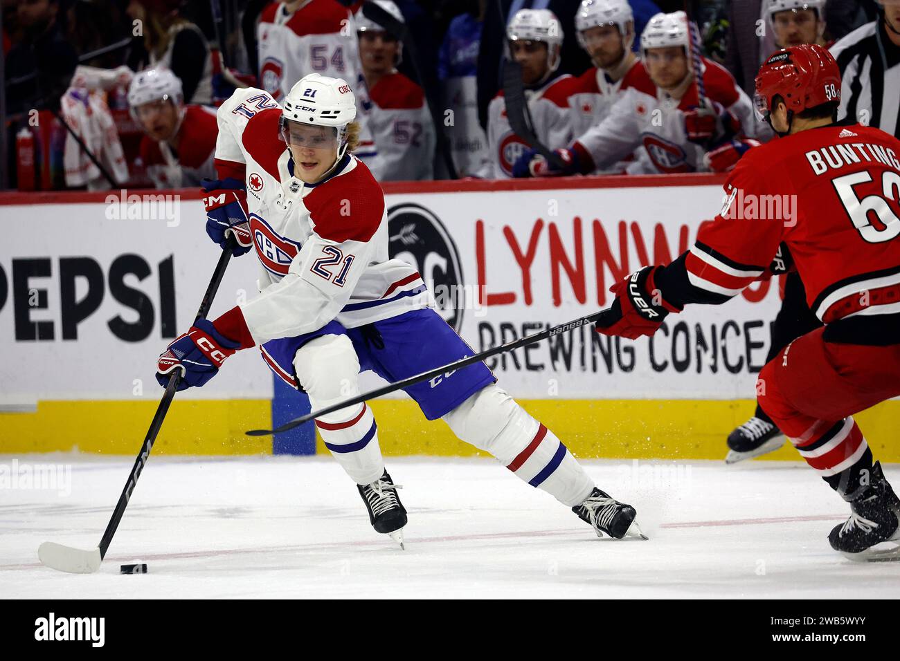 Montreal Canadiens' Kaiden Guhle (21) moves the puck away from Carolina ...