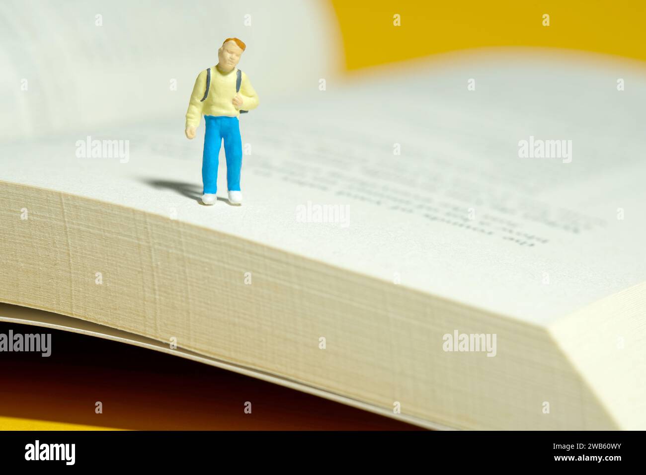 Miniature tiny people toy photography. A boy with school backpack ...