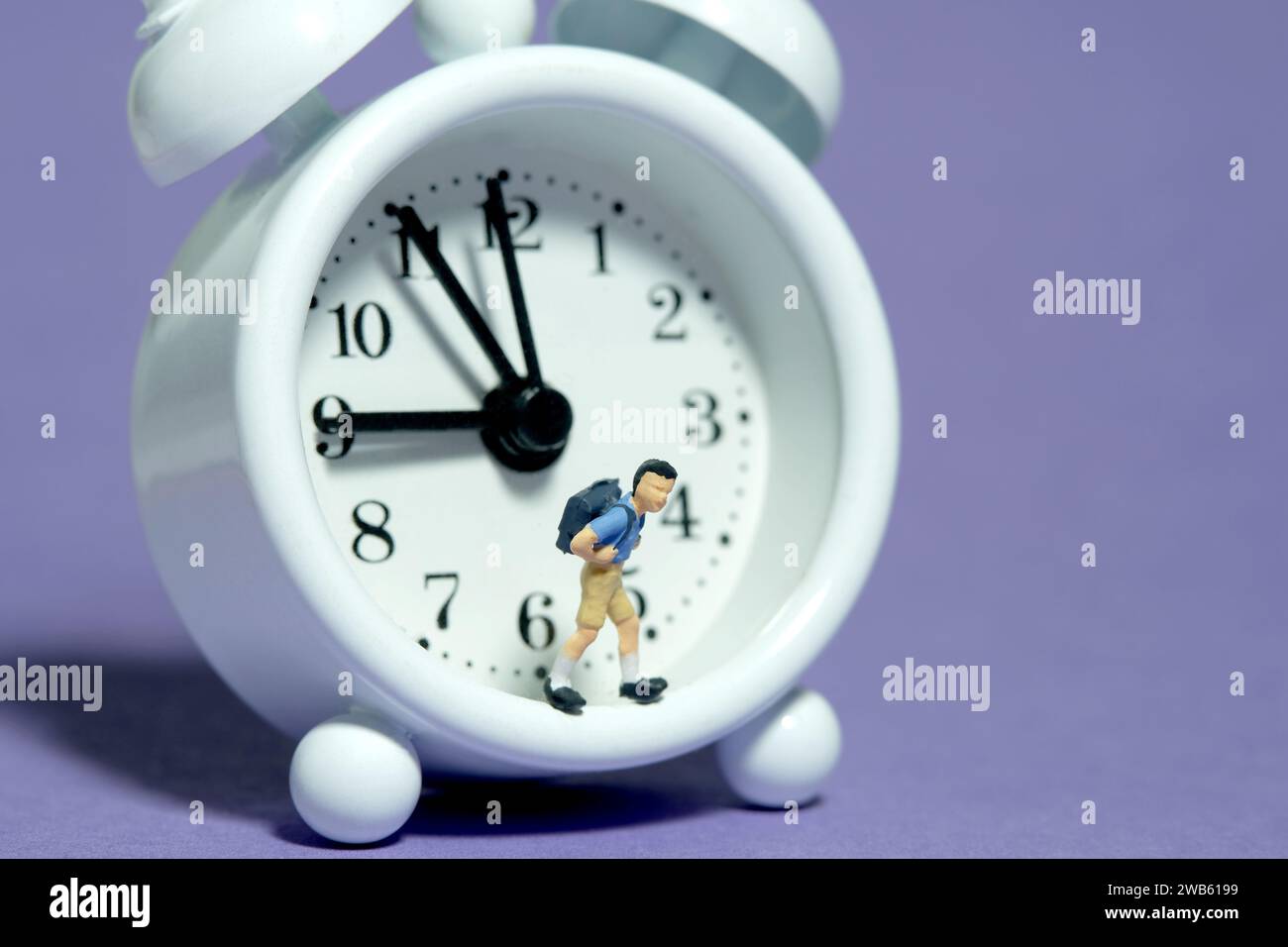 Miniature tiny people toy photography. A boy student with backpack ...