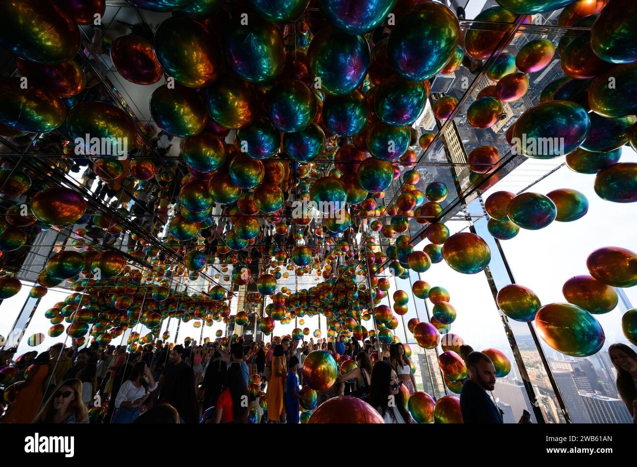 People playing and enjoying the colorful Pride Day balloons at the ...