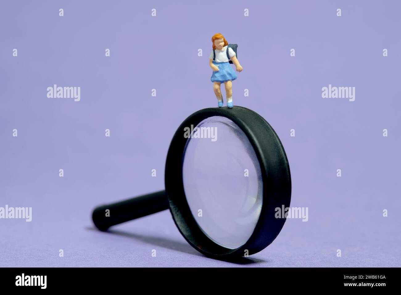 Miniature people toy figure photography. Children curiosity concept. A ...