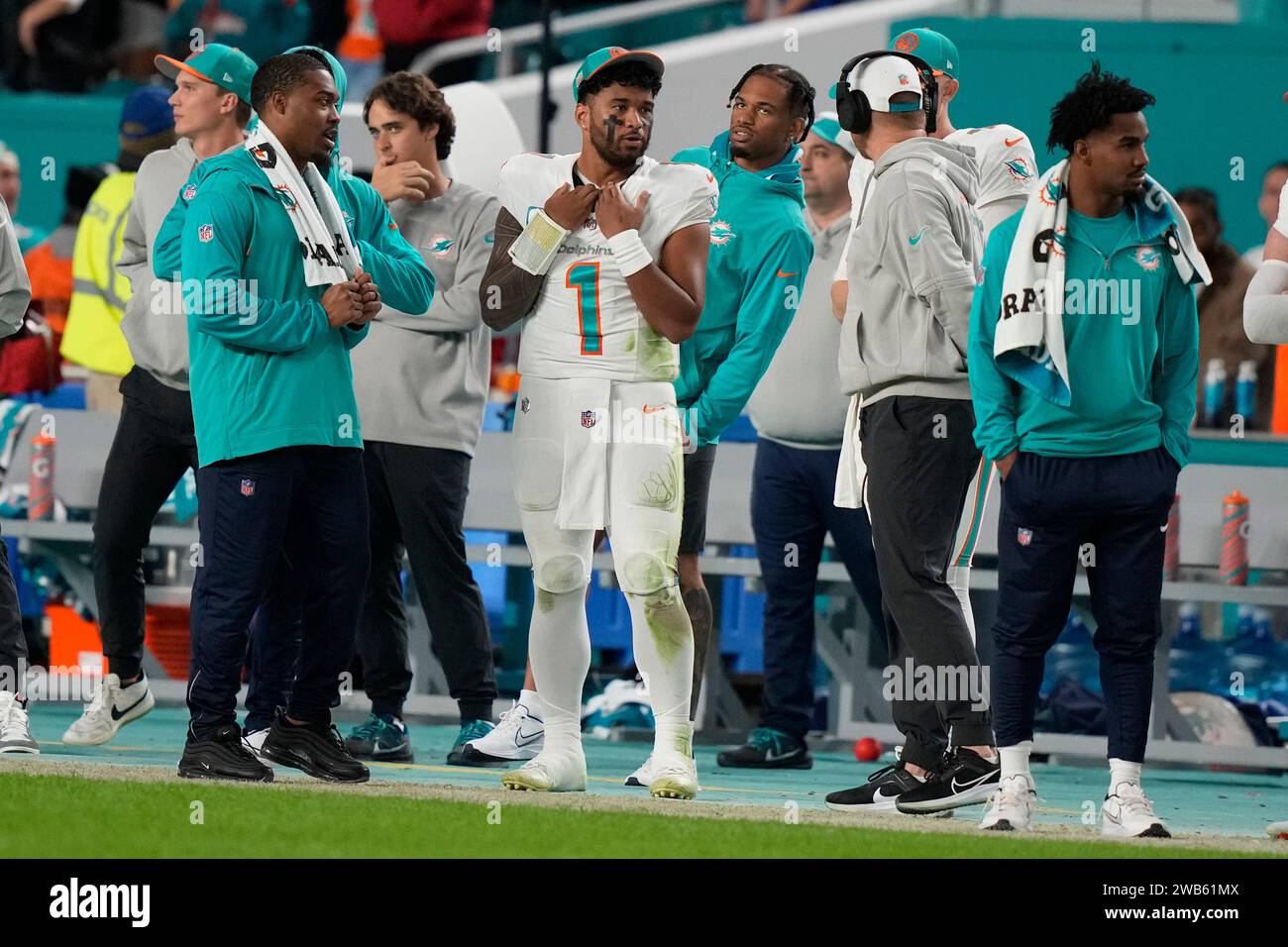 Miami Dolphins quarterback Tua Tagovailoa (1) stands on the sideline ...