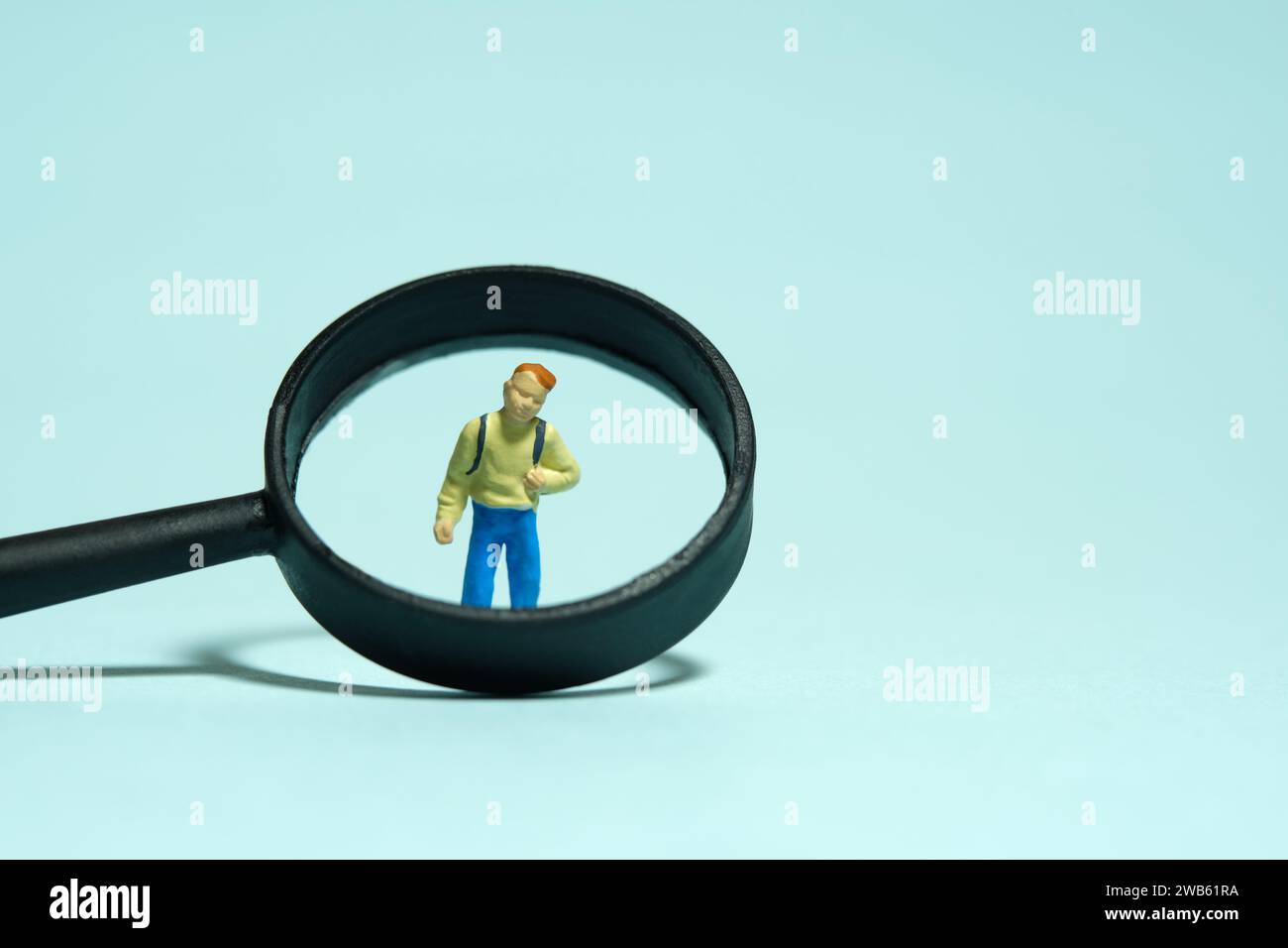 Miniature people toy figure photography. Children curiosity concept. A ...