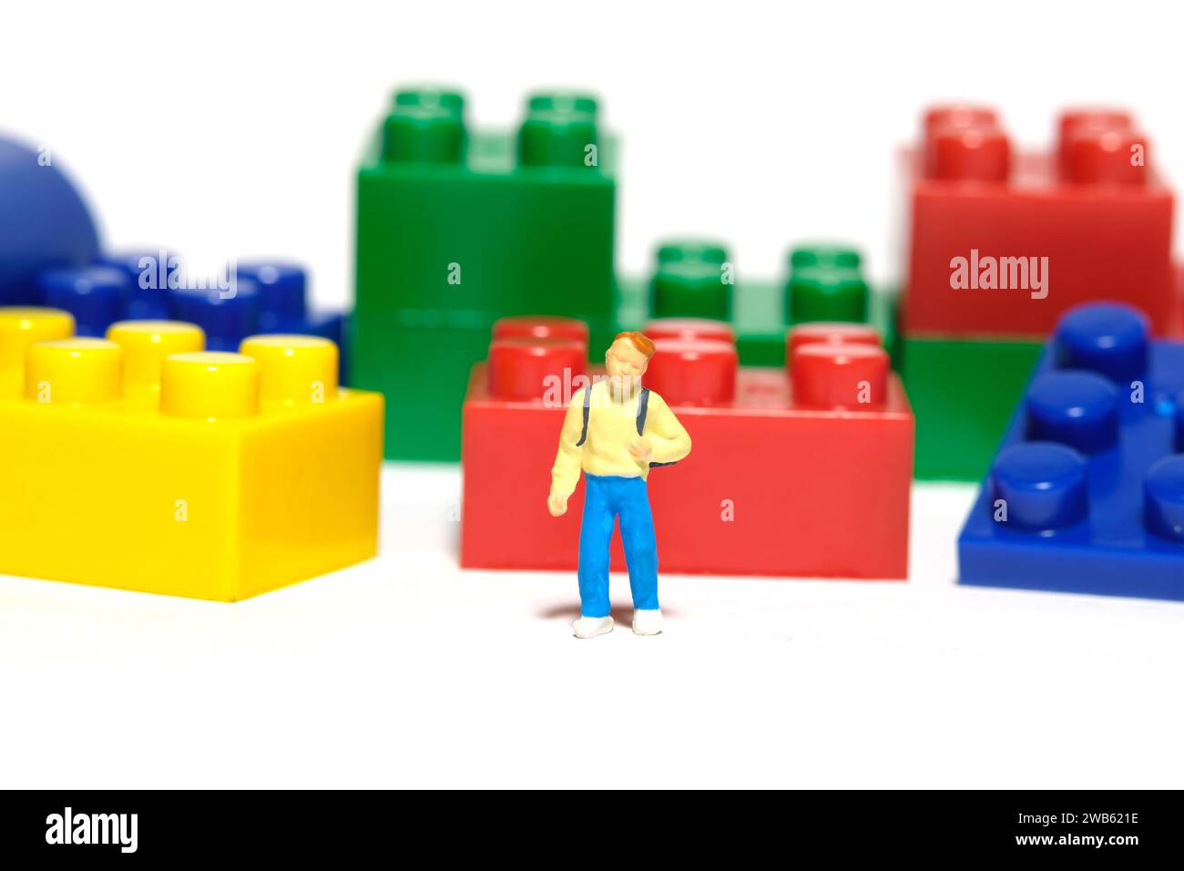 Miniature people toy figure photography. A boy kindergarten student ...