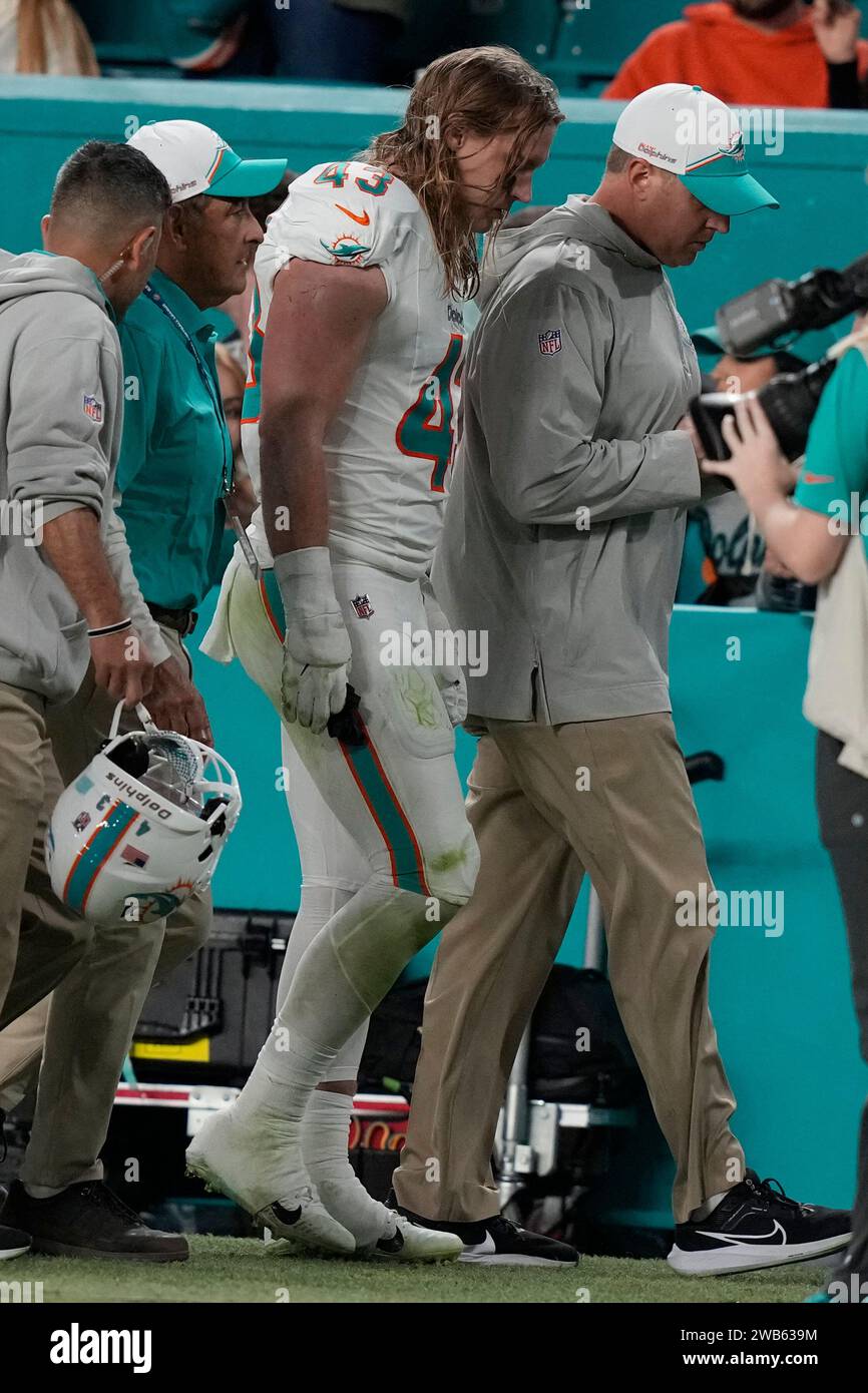 Miami Dolphins linebacker Andrew Van Ginkel (43) is helped off the ...