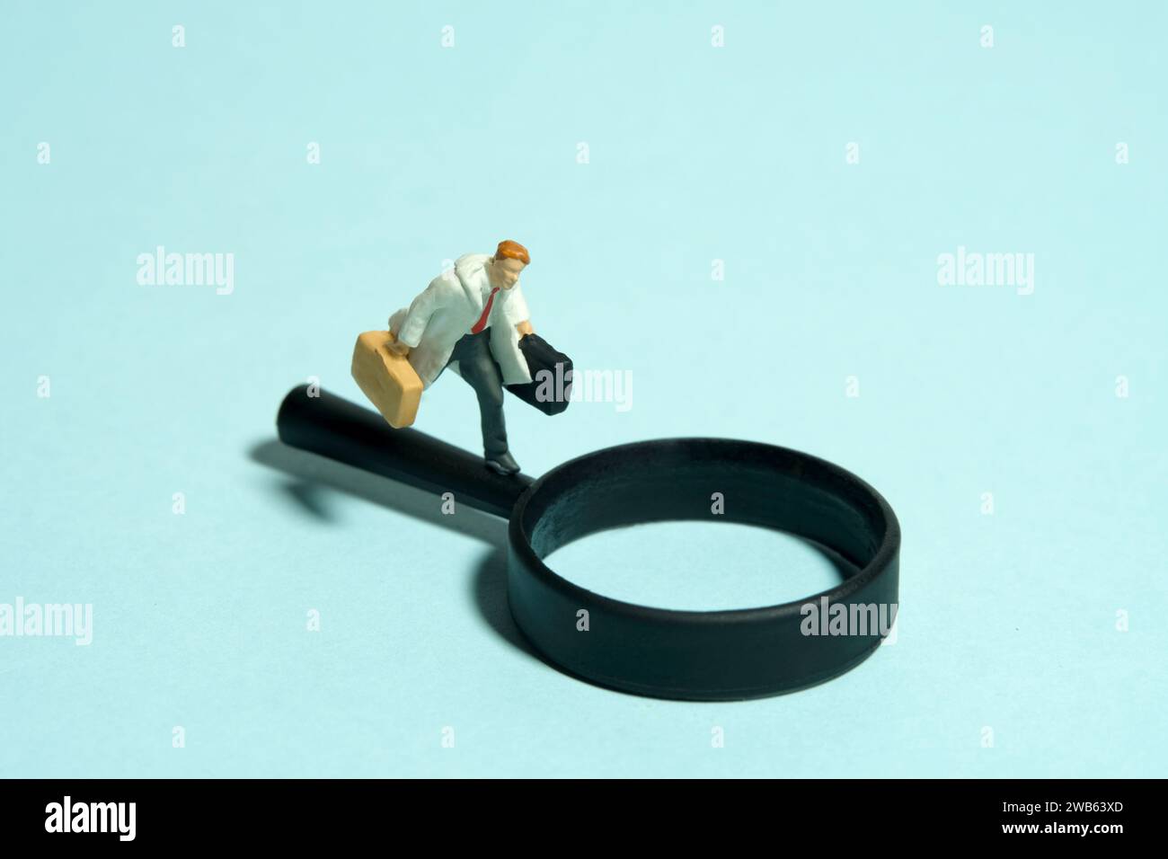 Miniature tiny people toy figure photography. A man wearing with coat ...