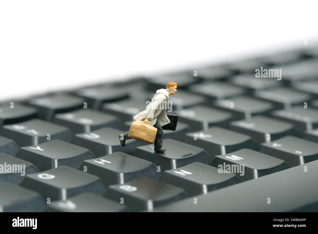 Miniature tiny people toy figure photography. A businessman running ...