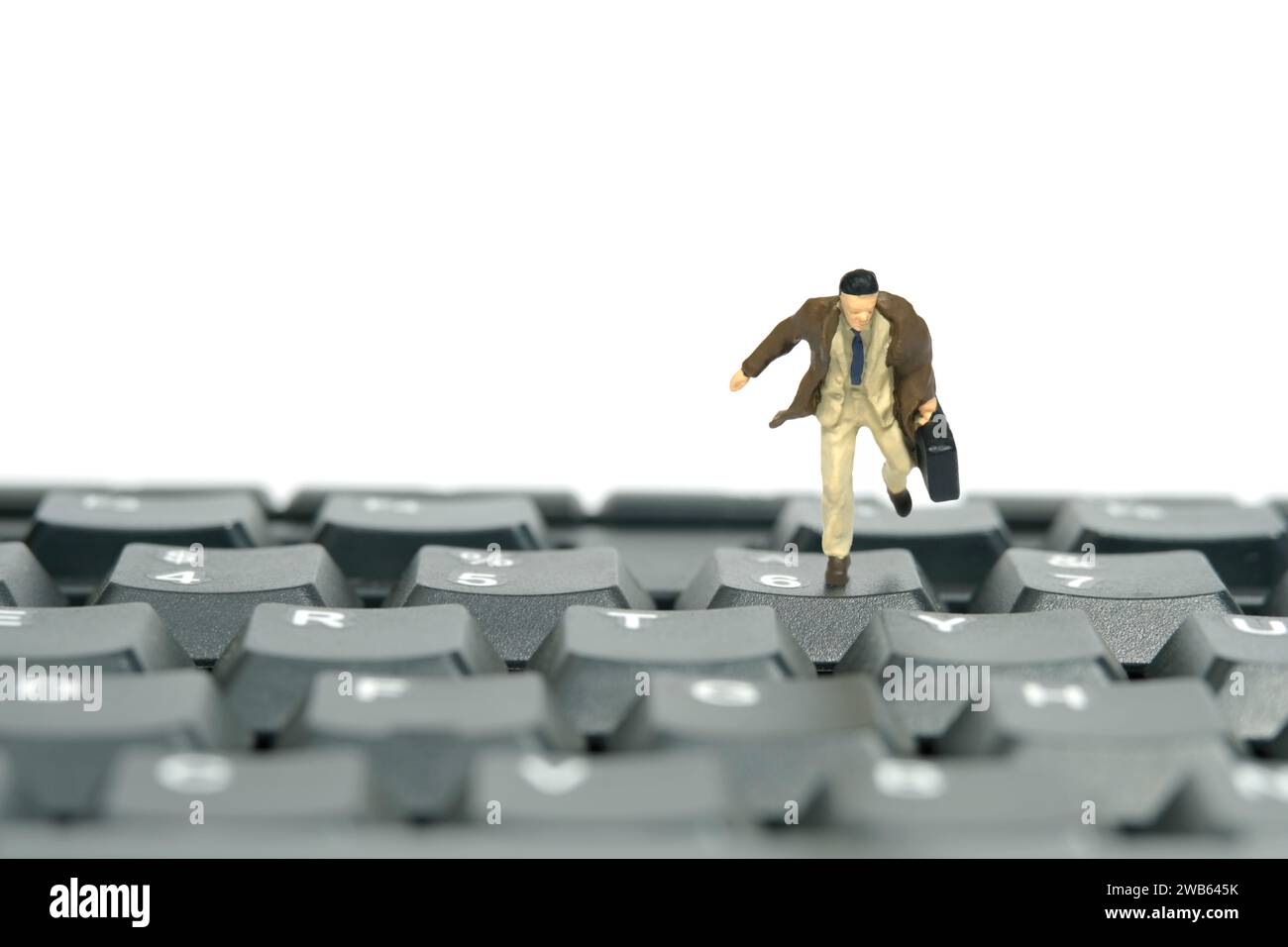 Miniature tiny people toy figure photography. A businessman running ...