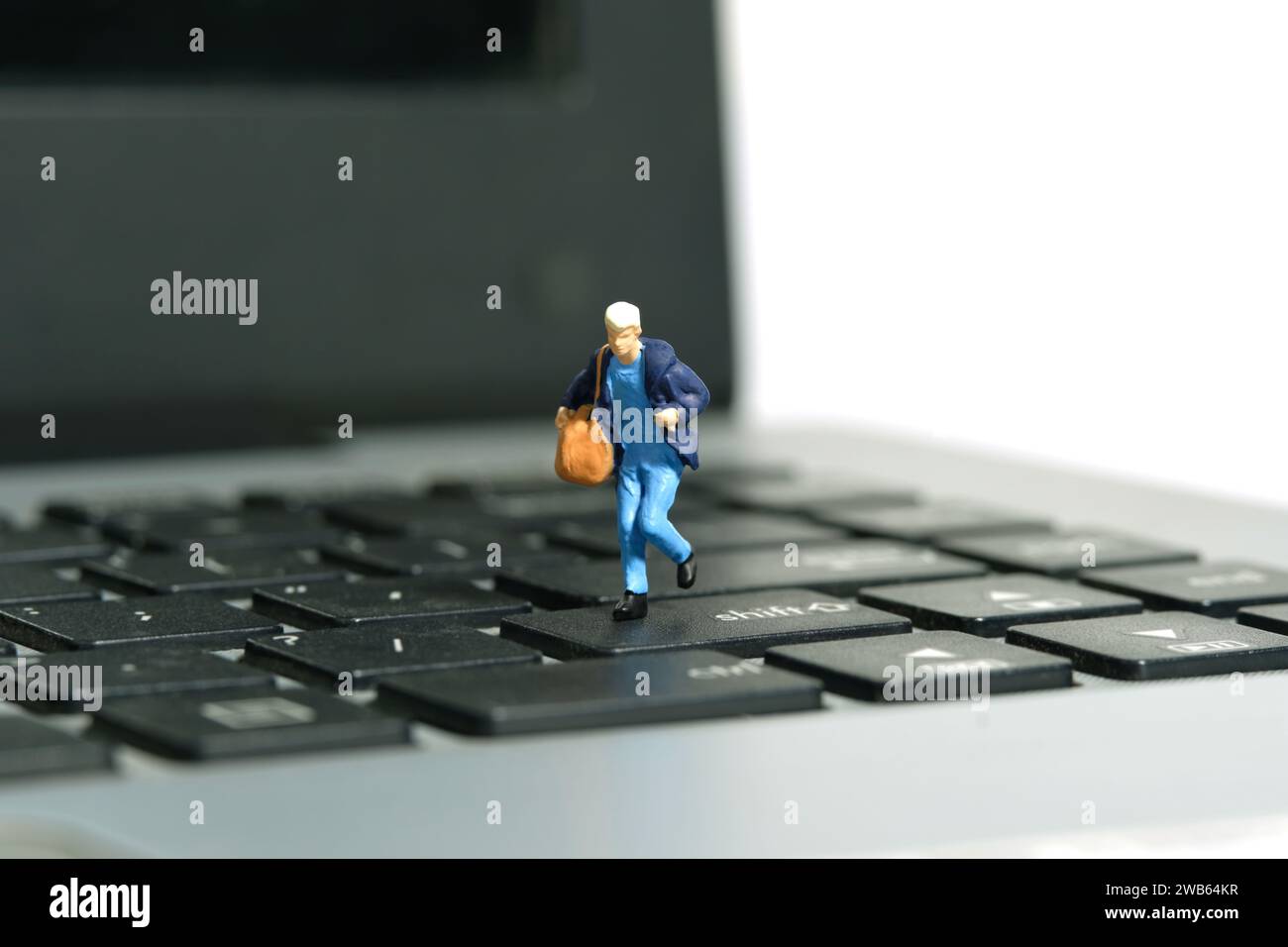 Miniature tiny people toy figure photography. A woman college student ...