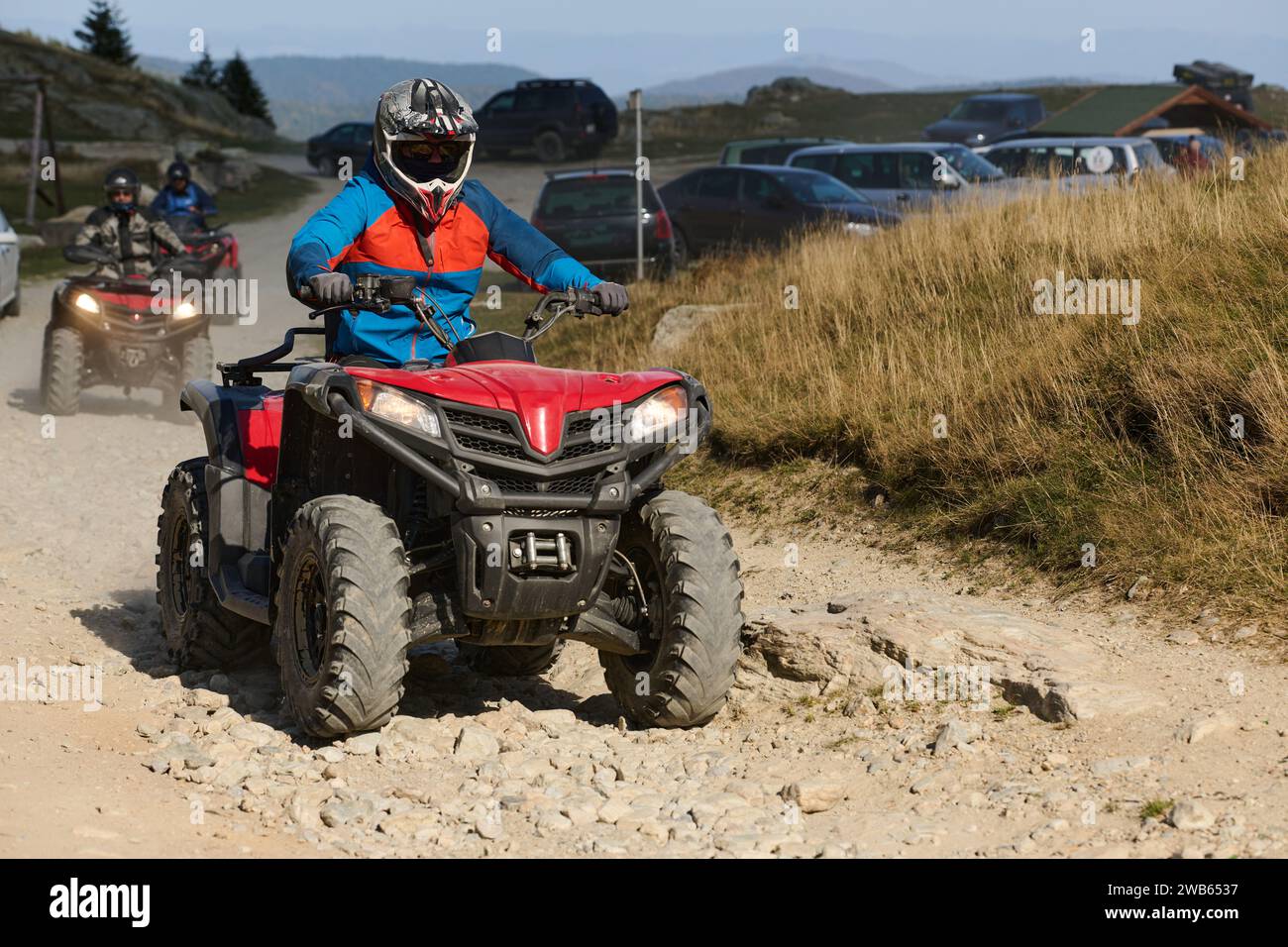 Man driving modern quad bike on sandy road. Extreme sport Stock Photo ...