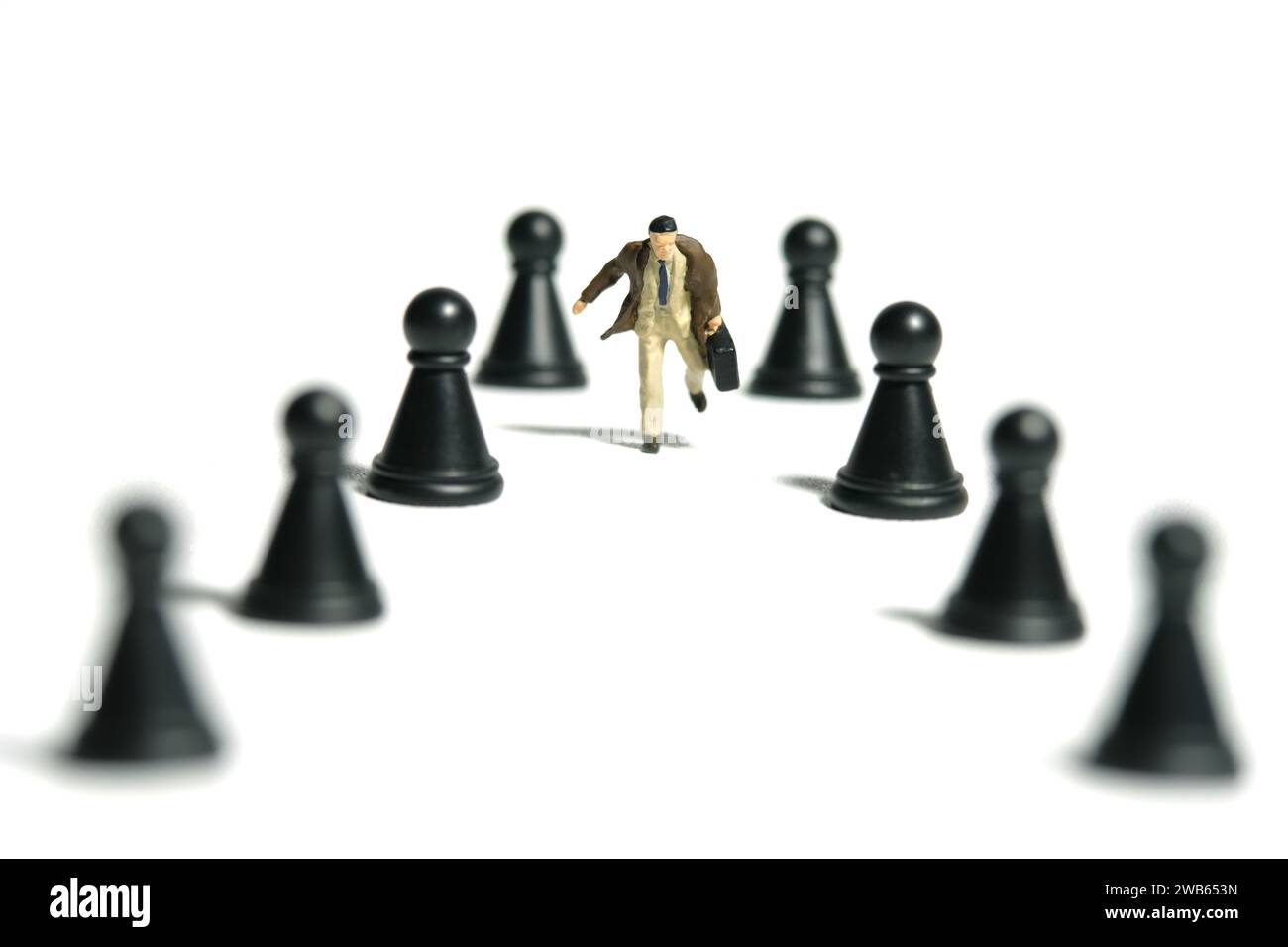 Miniature tiny people toy figure photography. A businessman running in ...