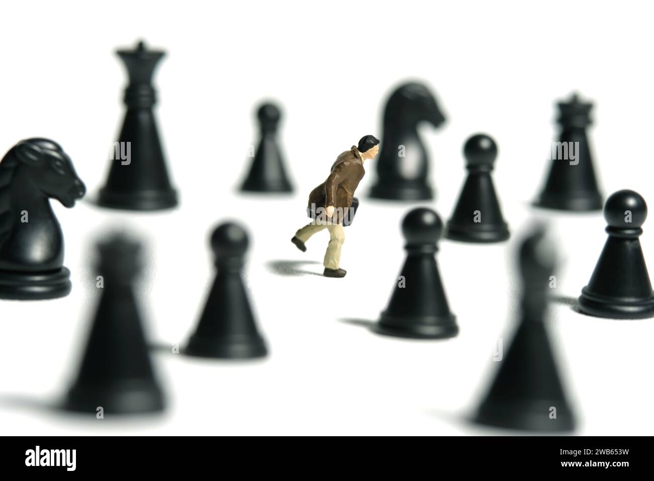 Miniature tiny people toy figure photography. A businessman running in ...