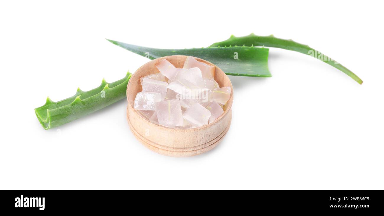 Peeled aloe vera in bowl and green leaves isolated on white Stock Photo ...