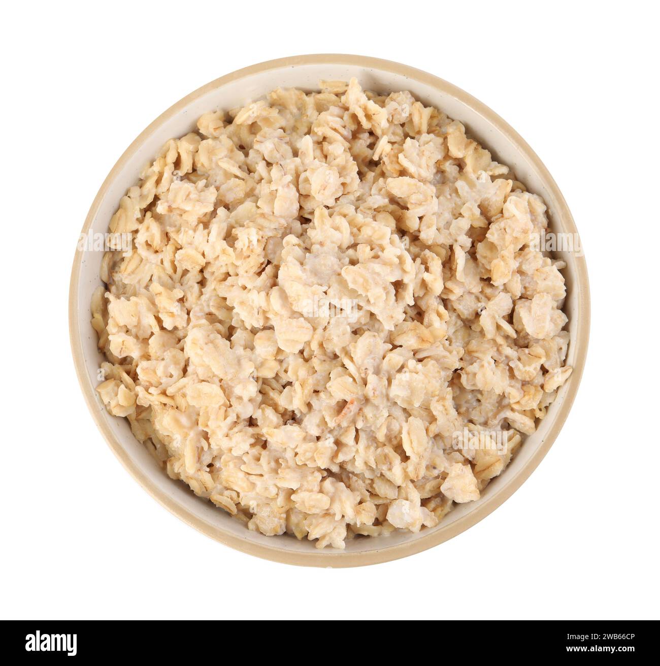 Tasty boiled oatmeal in bowl isolated on white, top view Stock Photo ...