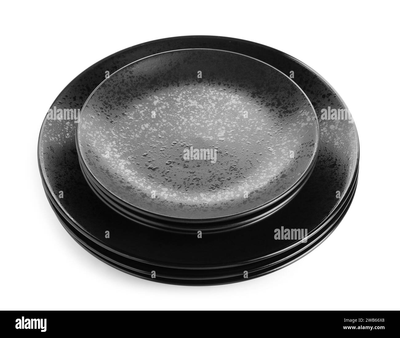 Stack of black ceramic plates isolated on white Stock Photo - Alamy