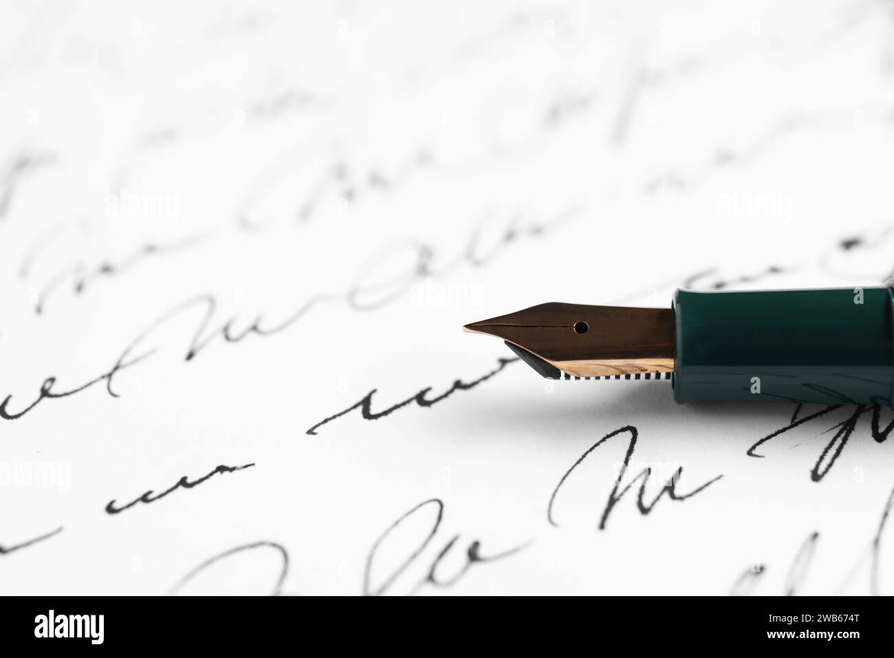 Elegant fountain pen on handwritten letter, closeup Stock Photo - Alamy