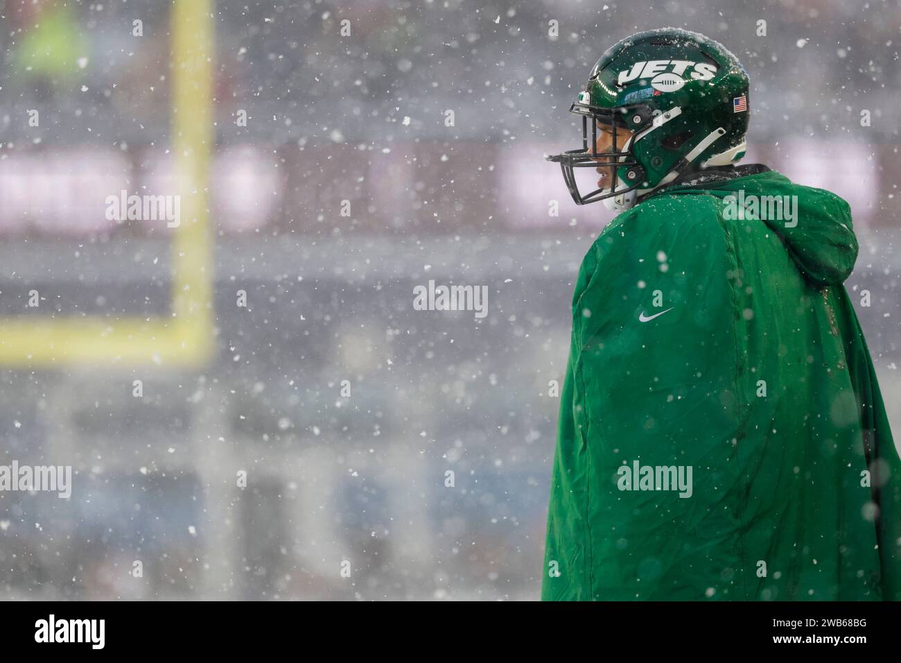 New York Jets linebacker Jermaine Johnson (11) wears a jacket on the ...