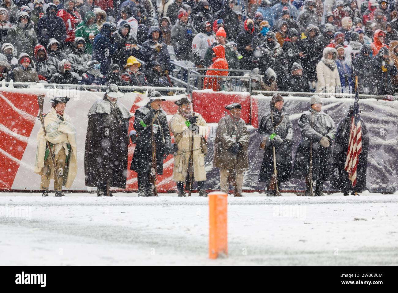 New England Patriots end zone militia stand guard in the falling snow ...