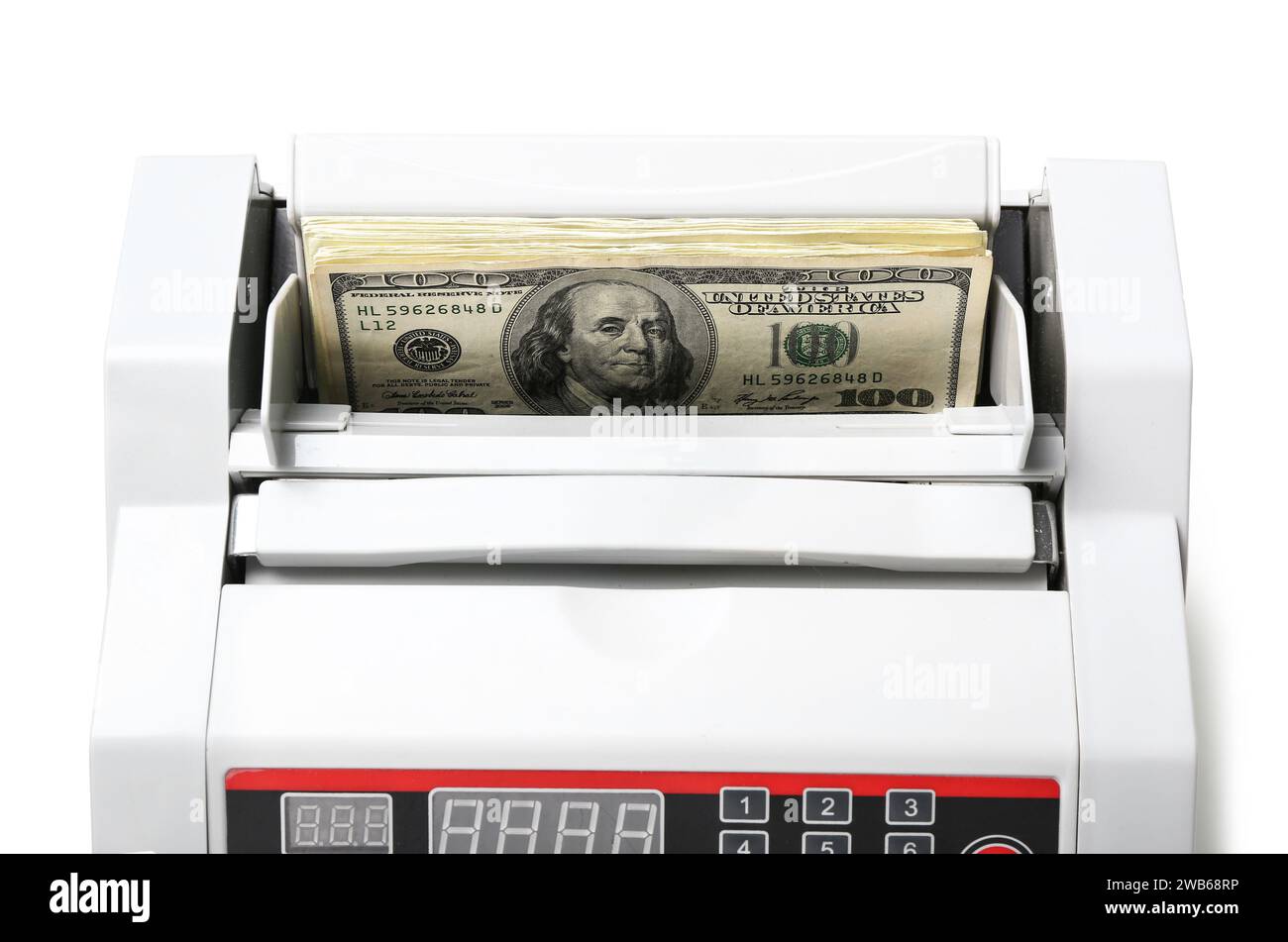 Modern cash counting machine with dollar banknotes on white background ...