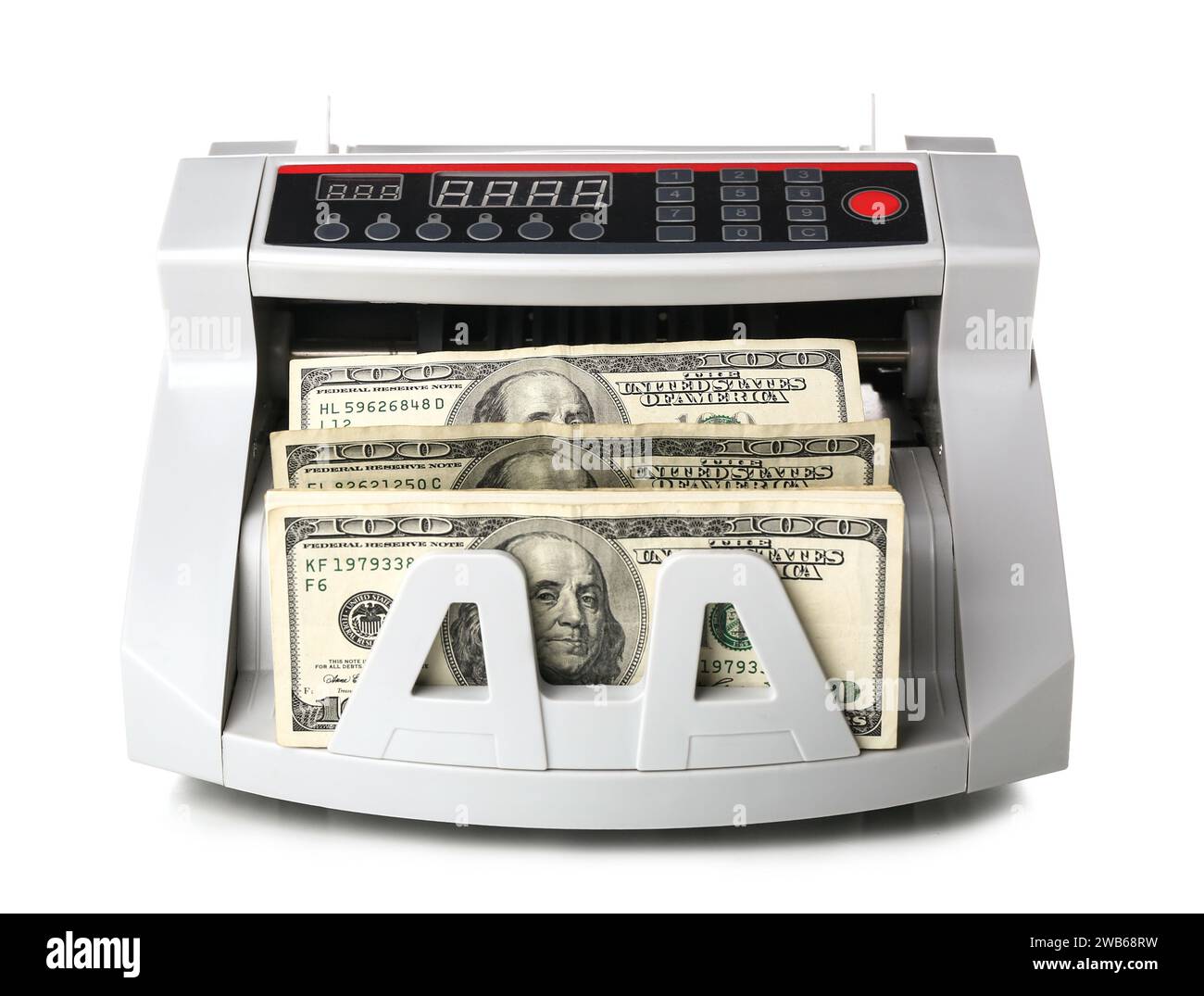 Modern cash counting machine with dollar banknotes on white background ...