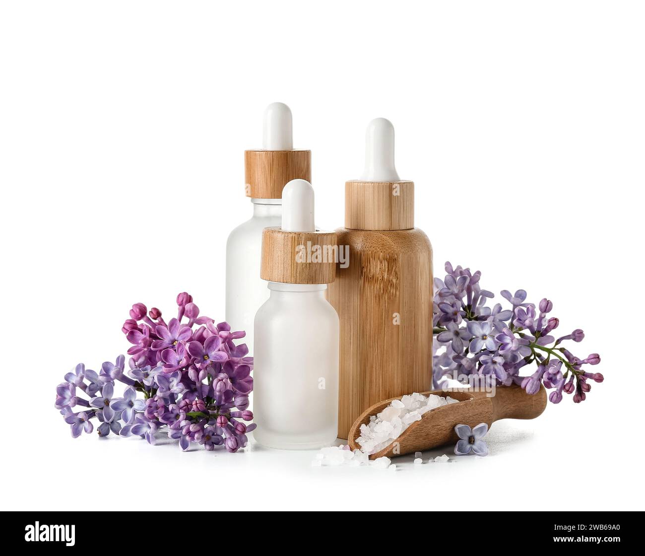 Bottles of cosmetic oil with beautiful lilac flowers and sea salt on ...