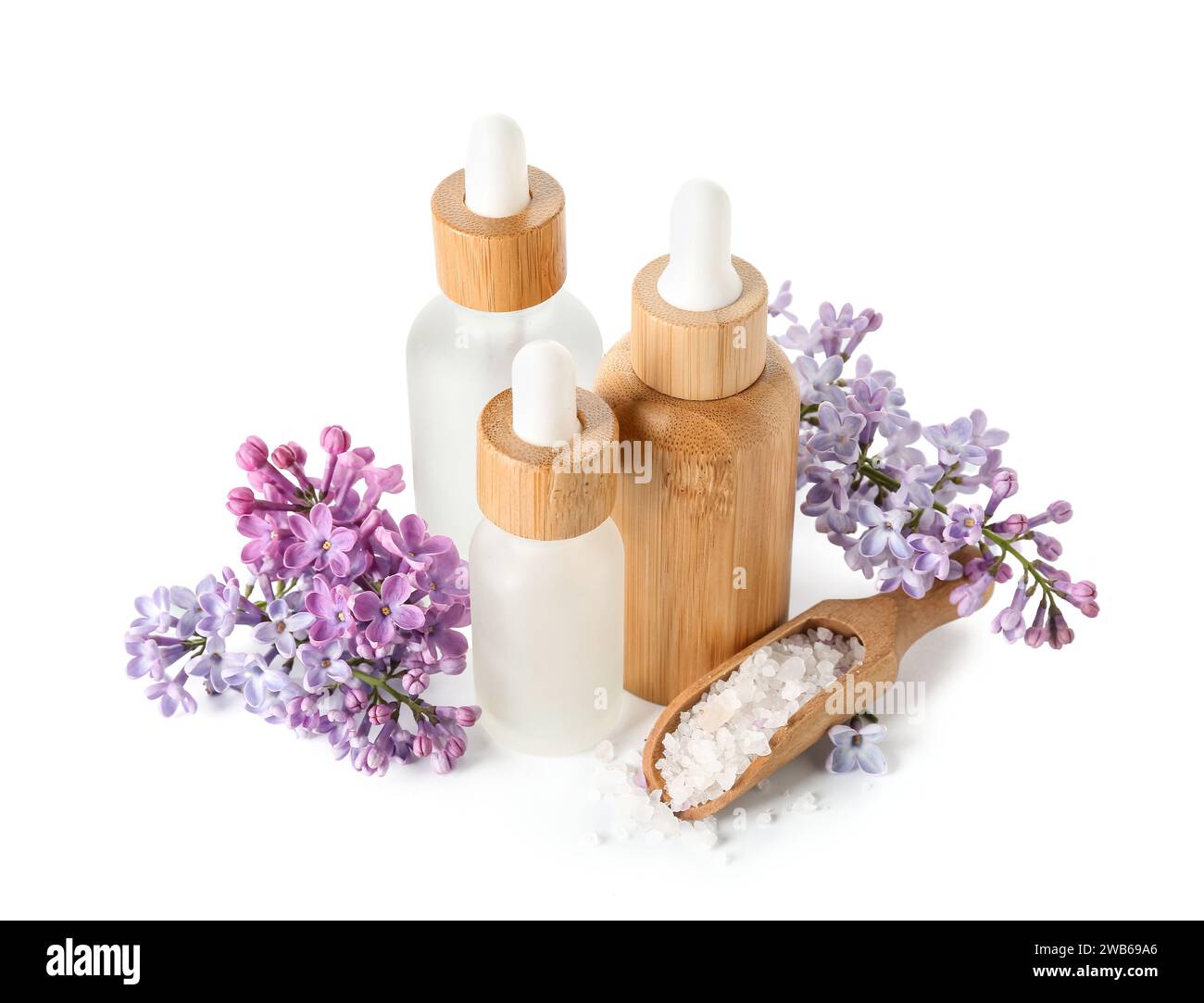 Bottles of cosmetic oil with beautiful lilac flowers and sea salt on ...