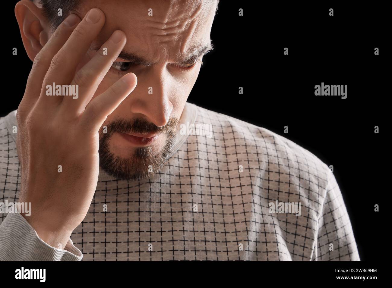 Young man having panic attack on black background, closeup Stock Photo ...