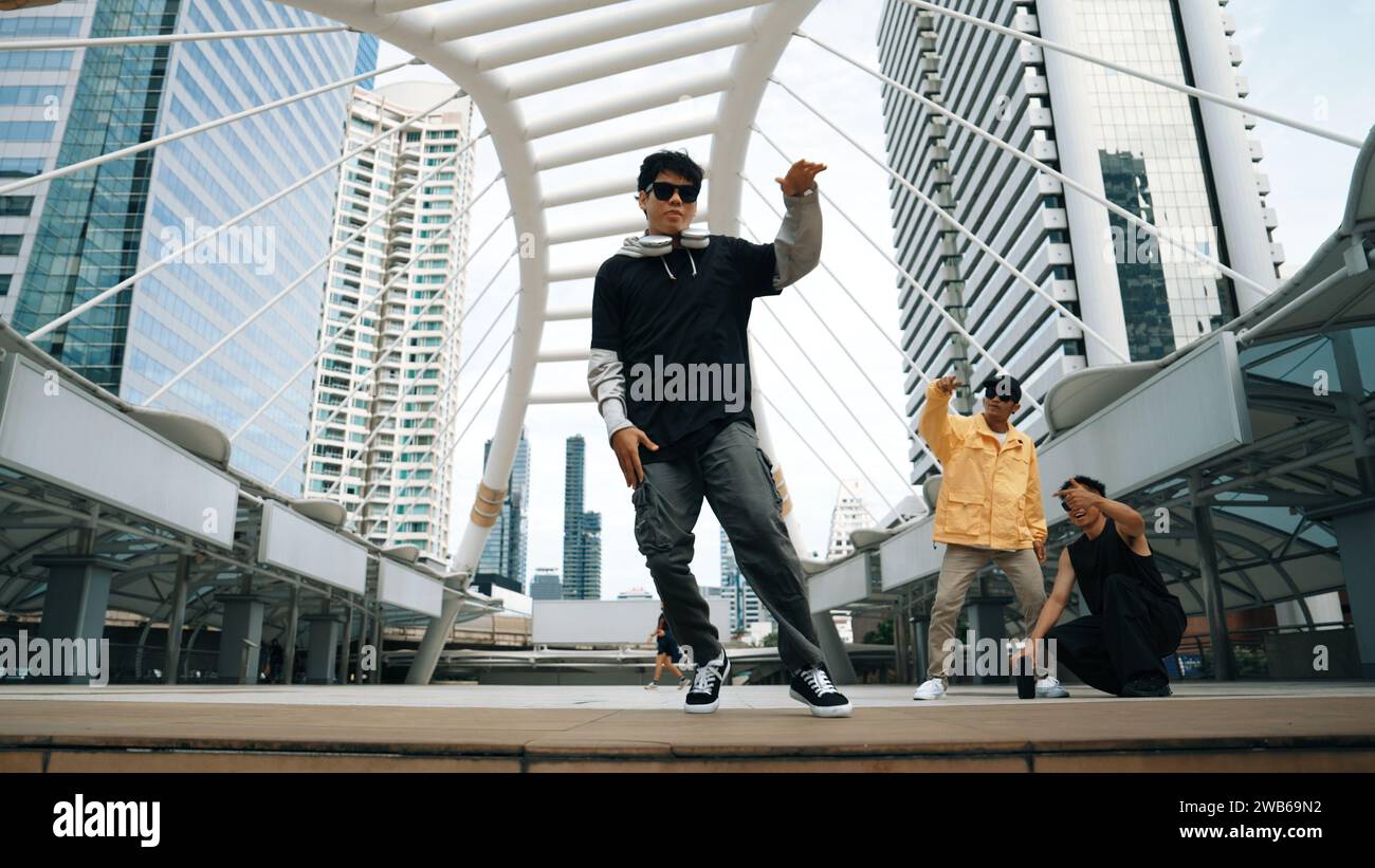 Group of professional street dancer cheer up while asian hipster ...