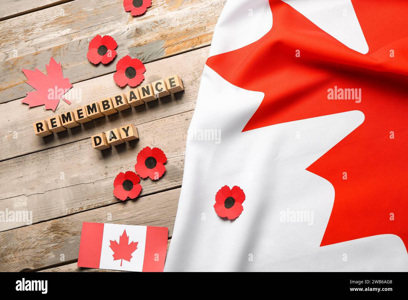 Poppy flowers with flags of Canada on wooden background. Remembrance ...