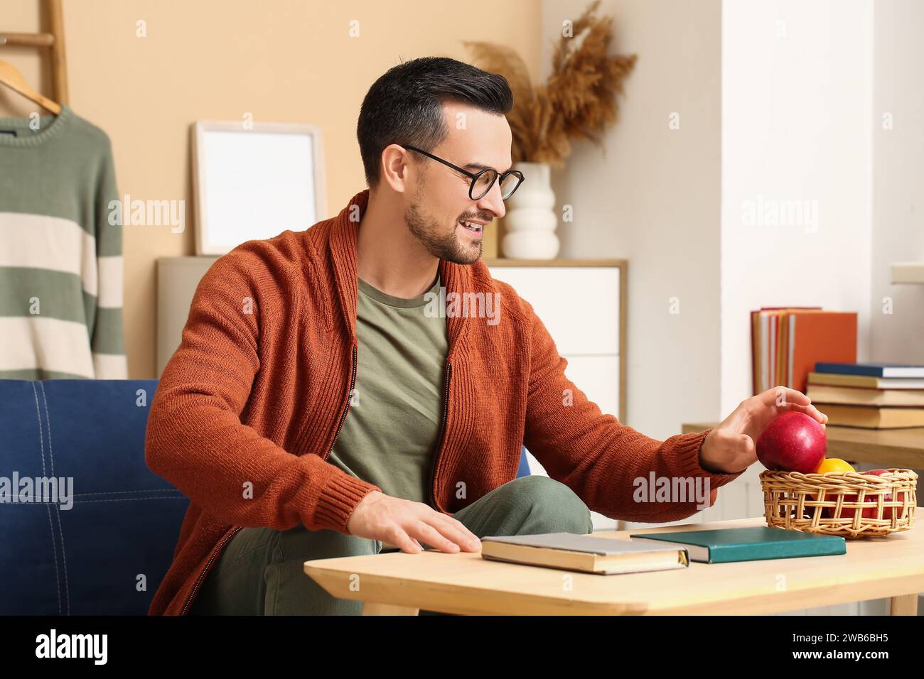 Taking apple handsome man hi-res stock photography and images - Alamy