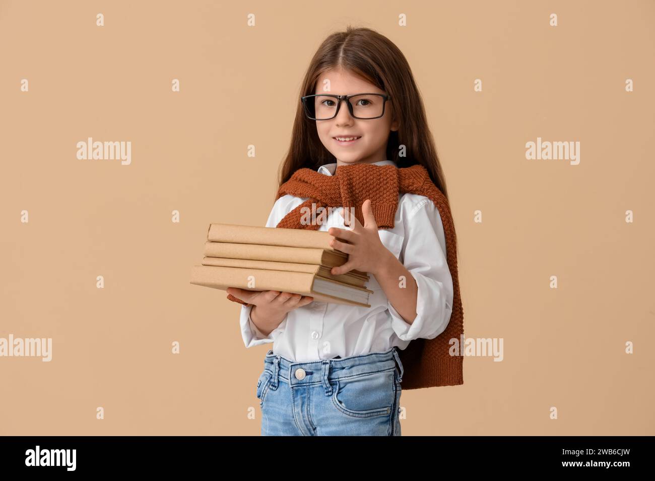 Cute little librarian with books on beige background. Opposite Day ...