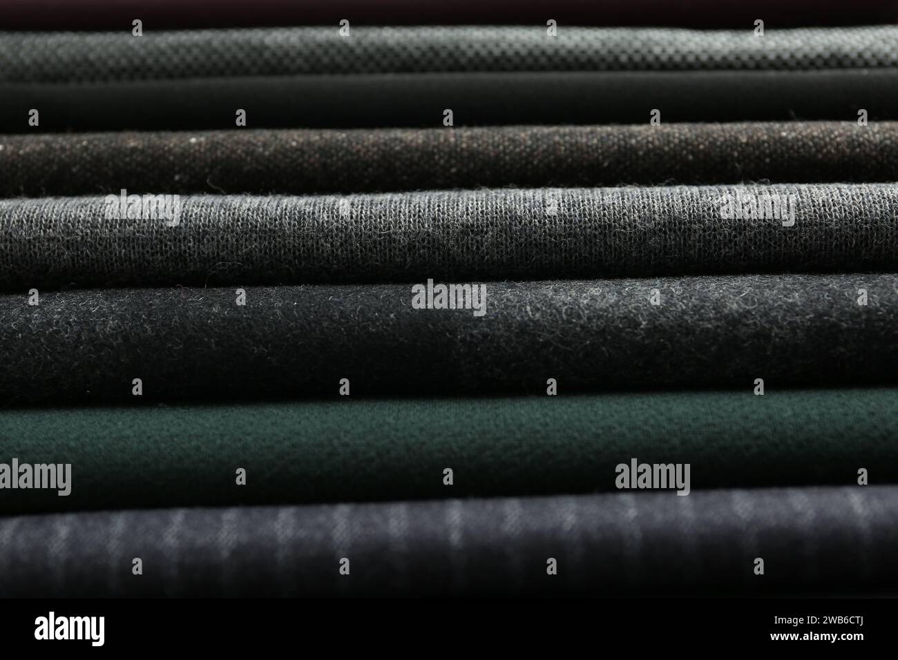 Stack of different fabric samples as background, closeup. Textile ...