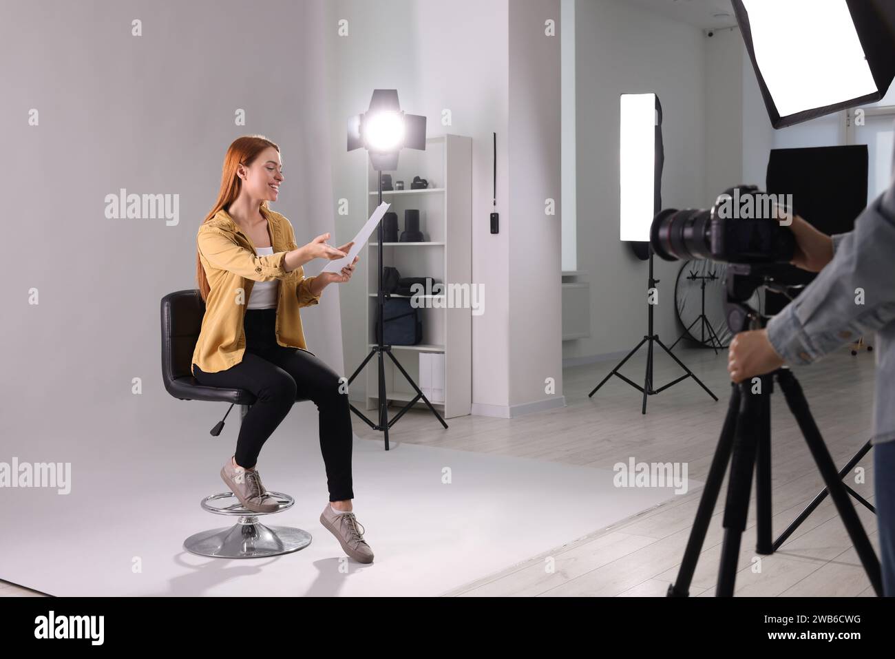 Casting call. Woman with script performing while camera operator ...