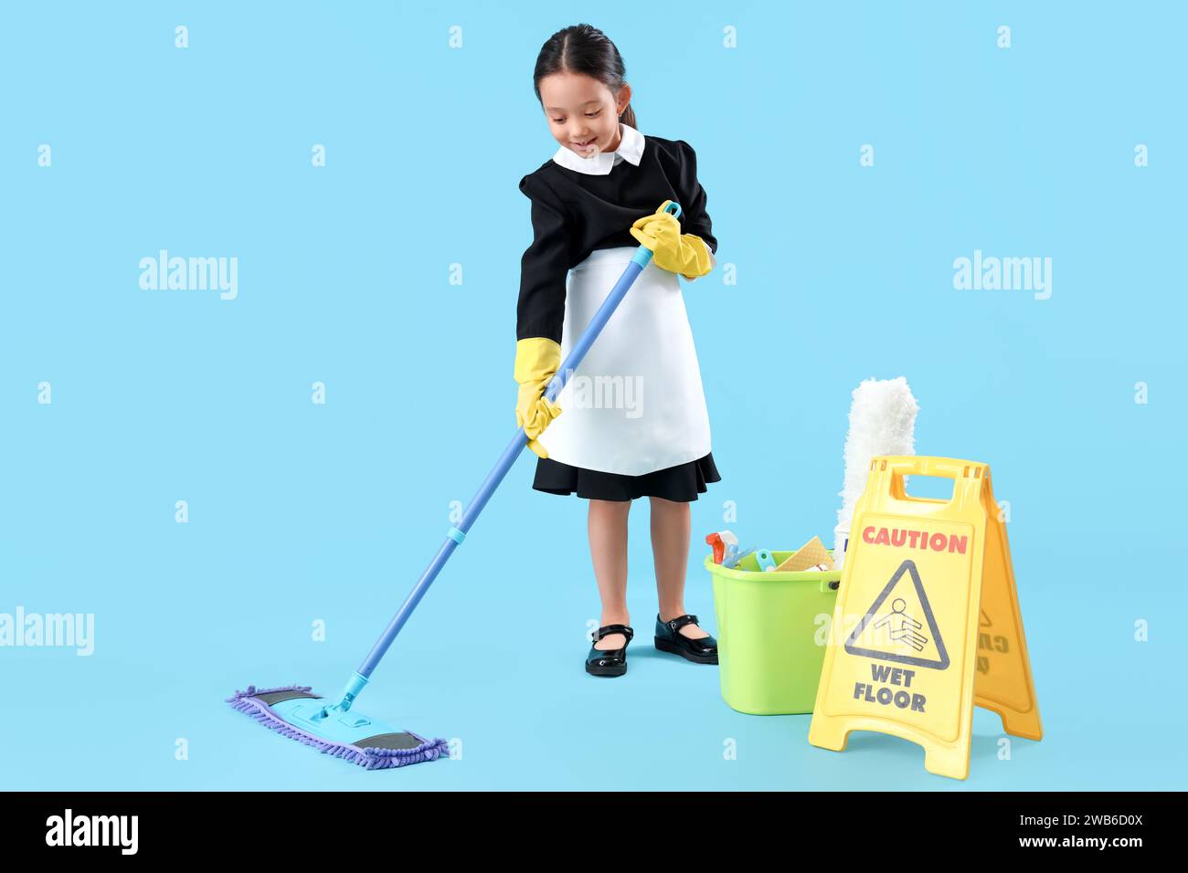 Cute little chambermaid mopping on blue background. Opposite Day ...