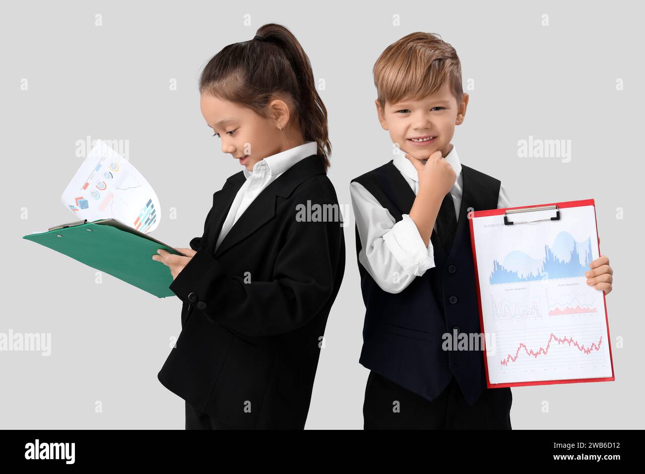 Cute little business colleagues with diagrams on light background ...