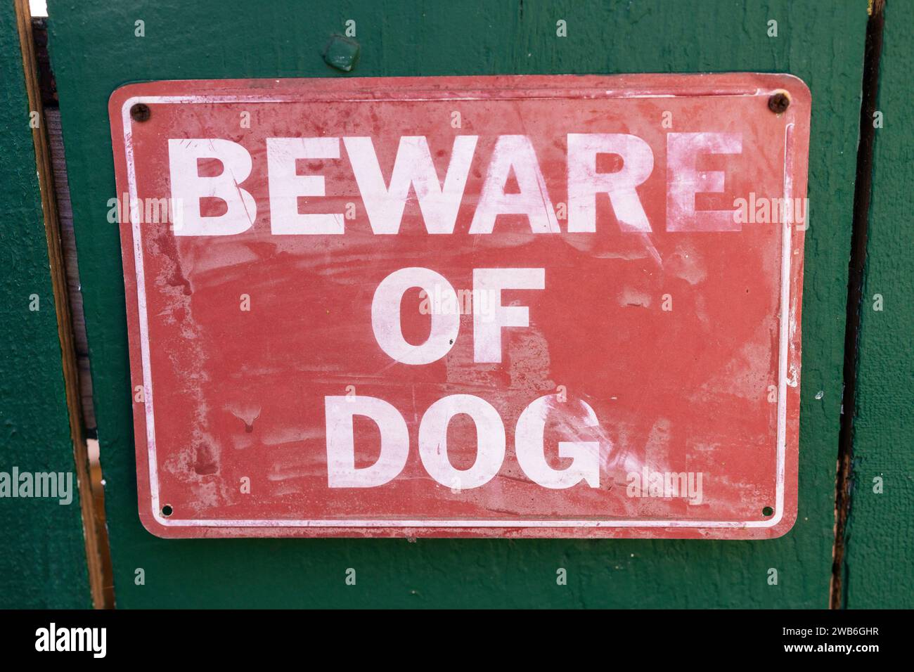 "Beware of Dog" sign on fence post Stock Photo - Alamy