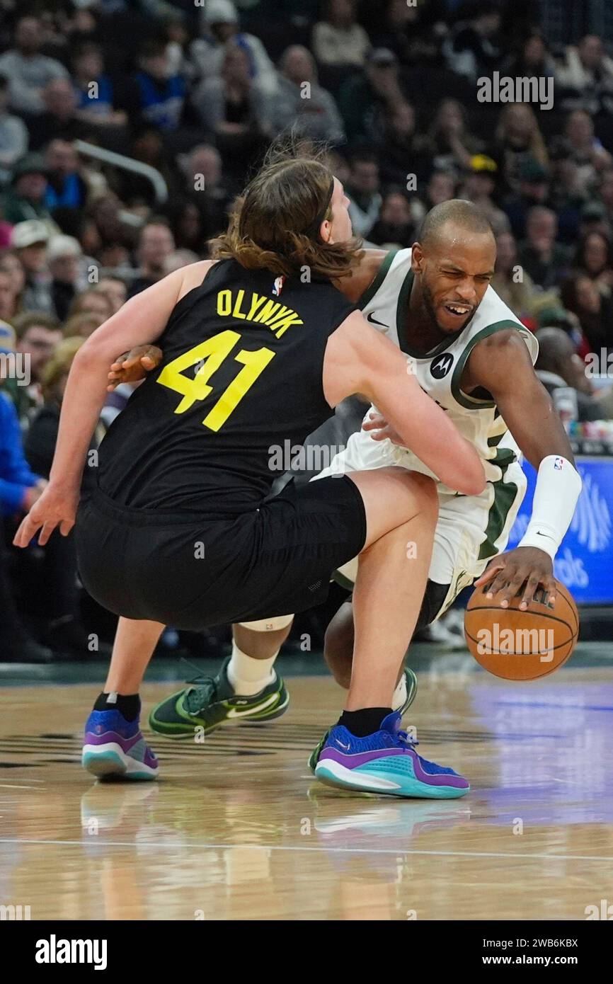Utah Jazz's Kelly Olynyk fouls Milwaukee Bucks' Khris Middleton during ...