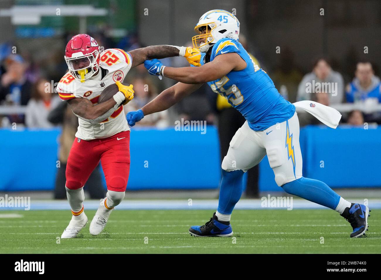Los Angeles Chargers linebacker Tuli Tuipulotu (45) tackles Kansas City ...