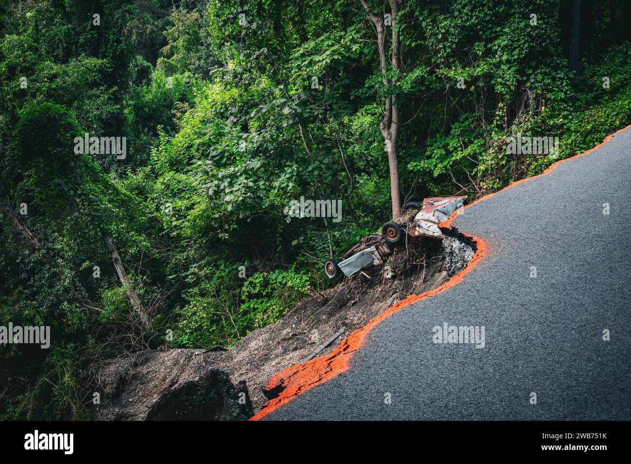 damaged and collapsed part of the concrete road due to flooding and ...